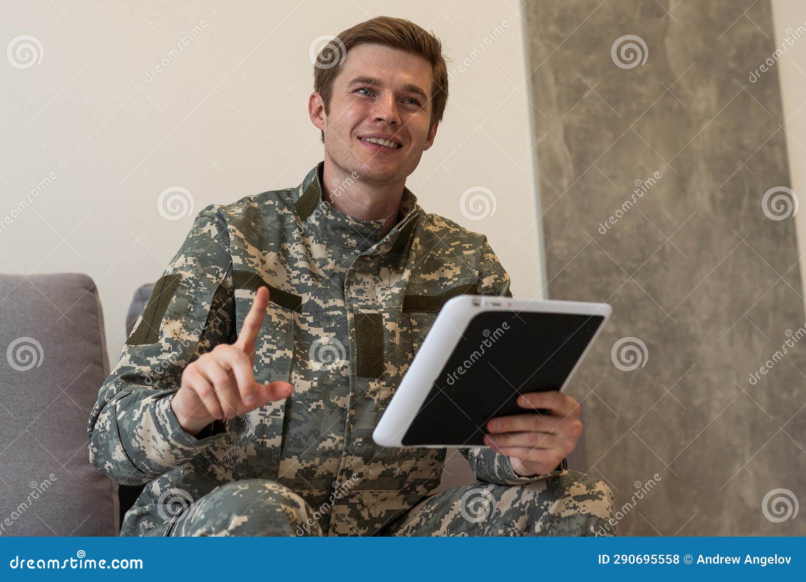 Happy Young Soldier Holding a Computer Tablet Stock Photo - Image of ...