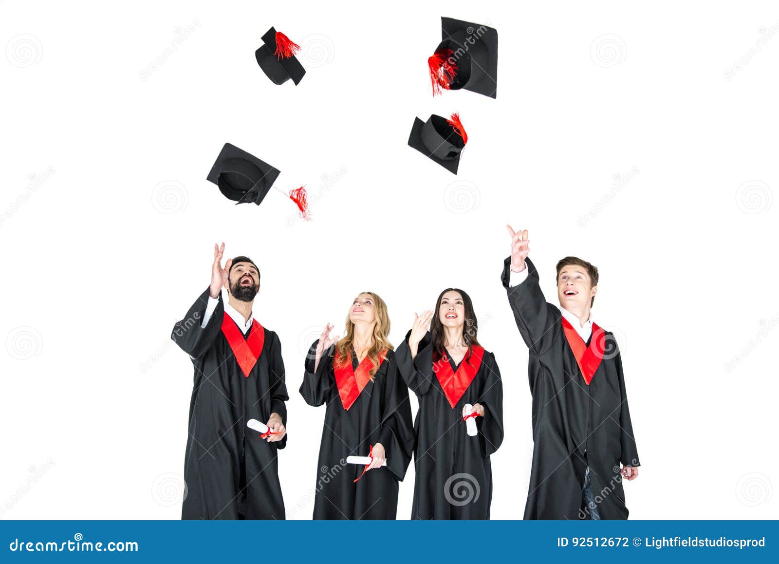 Happy Young Students with Diplomas Throwing Graduation Caps Isolated ...