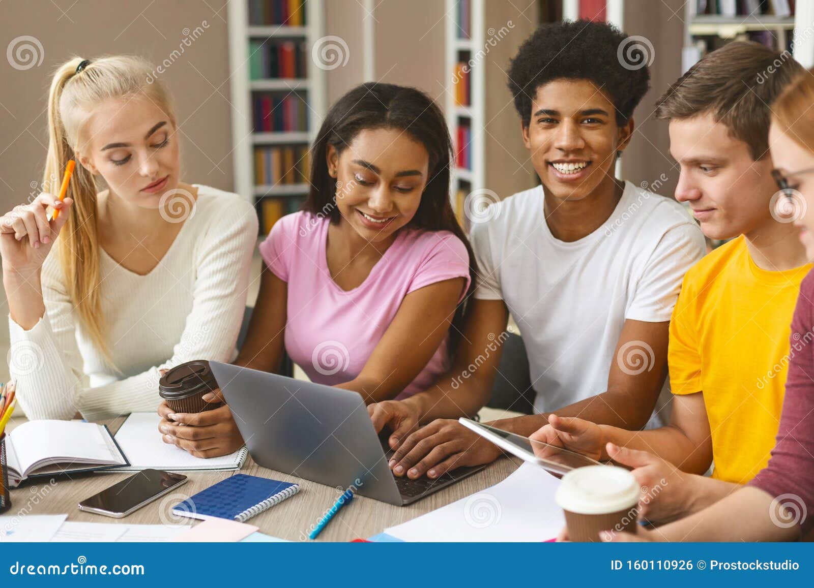 Happy Young Students Working on Project at Library Stock Photo - Image ...