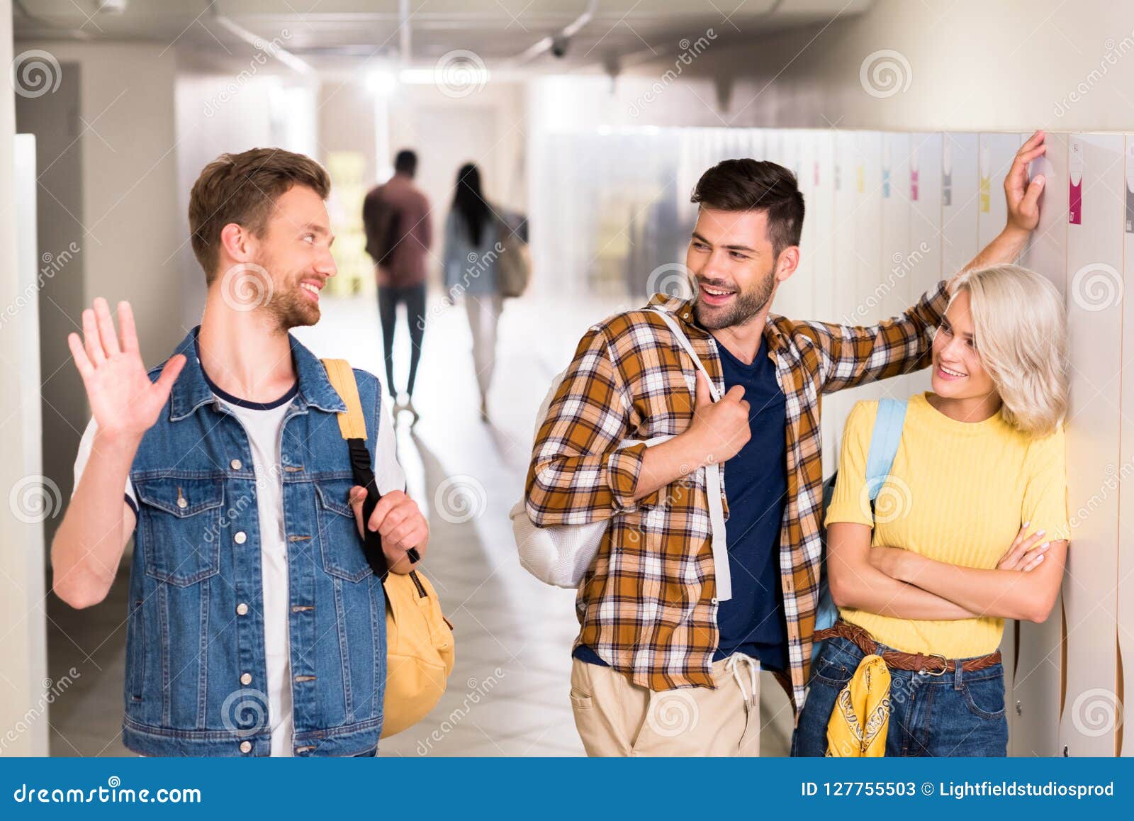 Two People Waving To Each Other