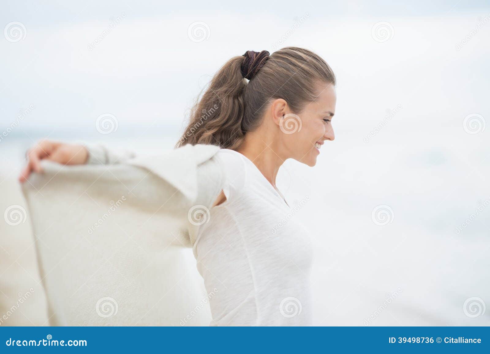 Happy Young Woman on Cold Beach Rejoicing Stock Photo - Image of ...