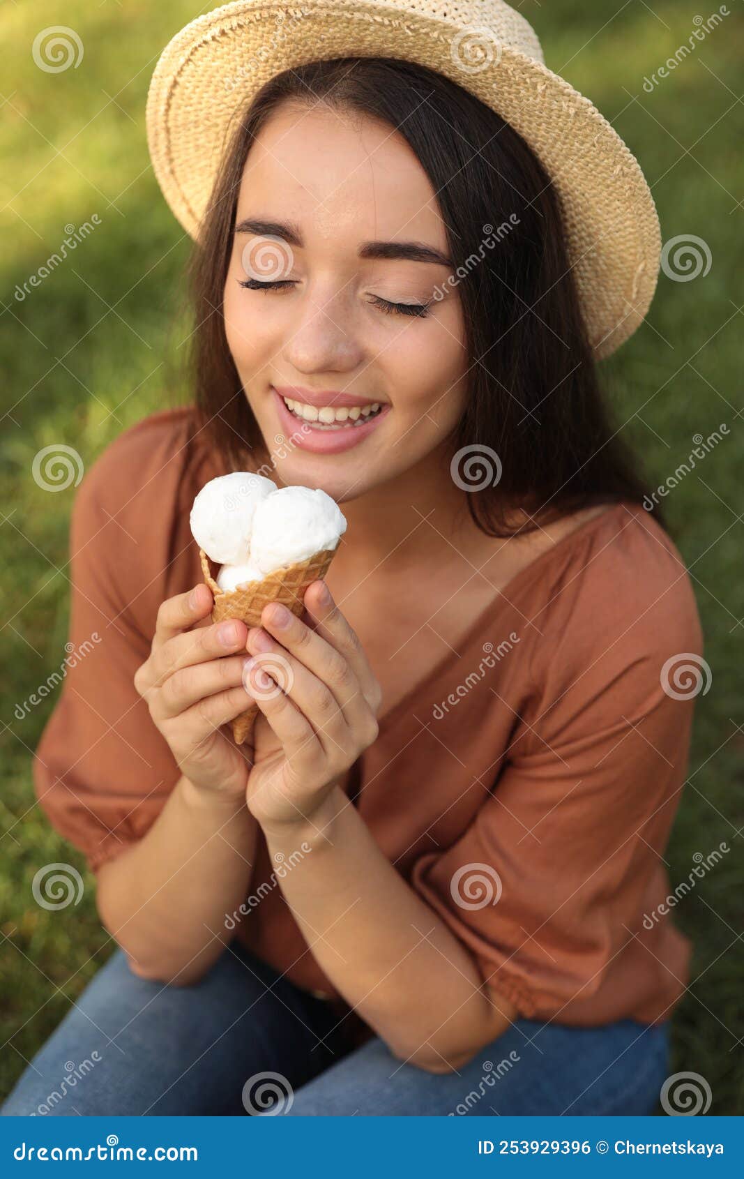 Happy Young Woman With Delicious Ice Cream In Waffle Cone Outdoors