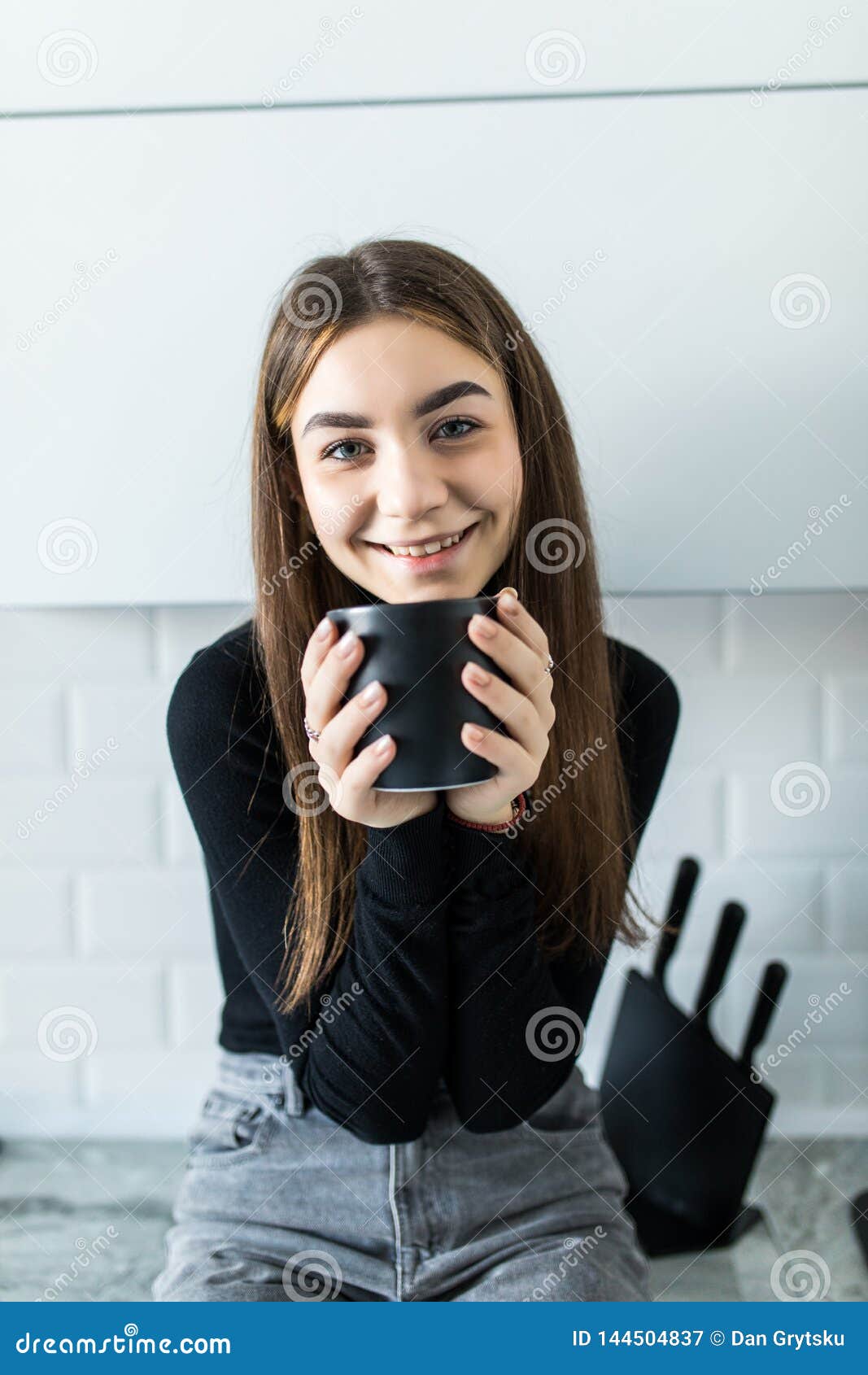 Happy Young Woman Drinking Tea in the Kitchen at Home Stock Image ...