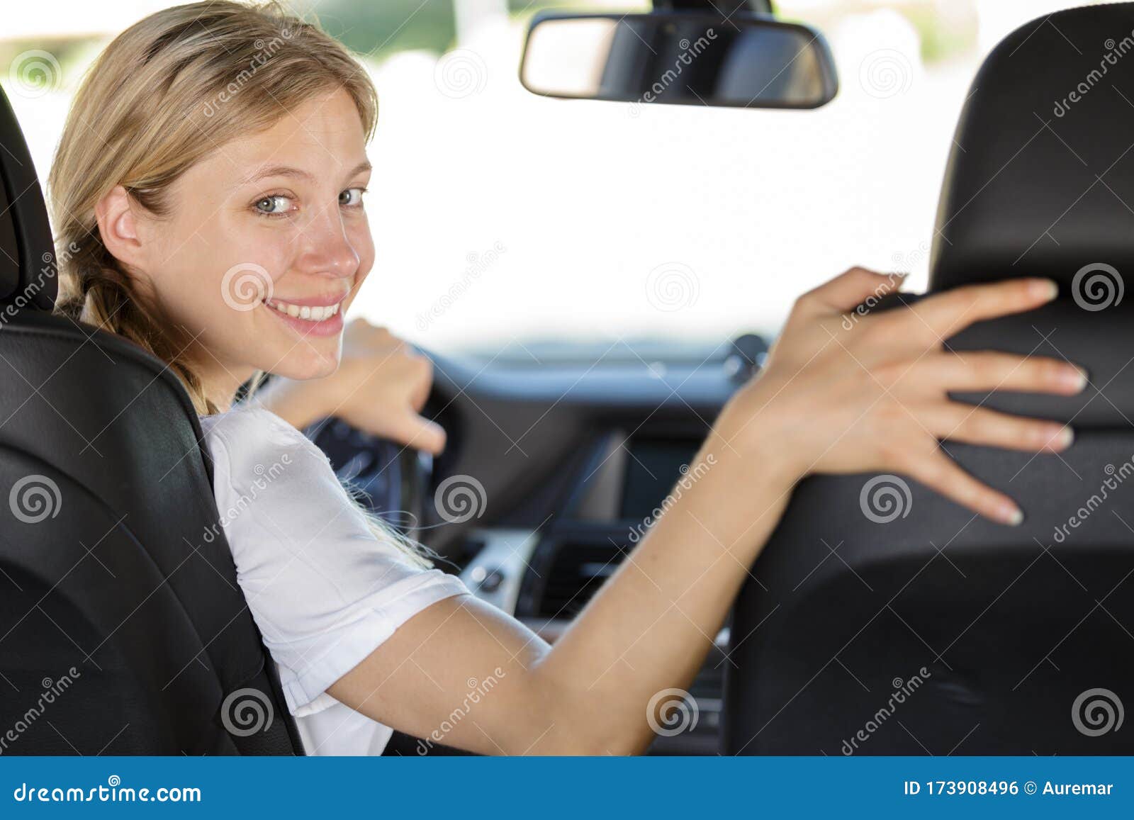 Happy Young Woman Driver Looking Backwards Stock Photo - Image of rear ...