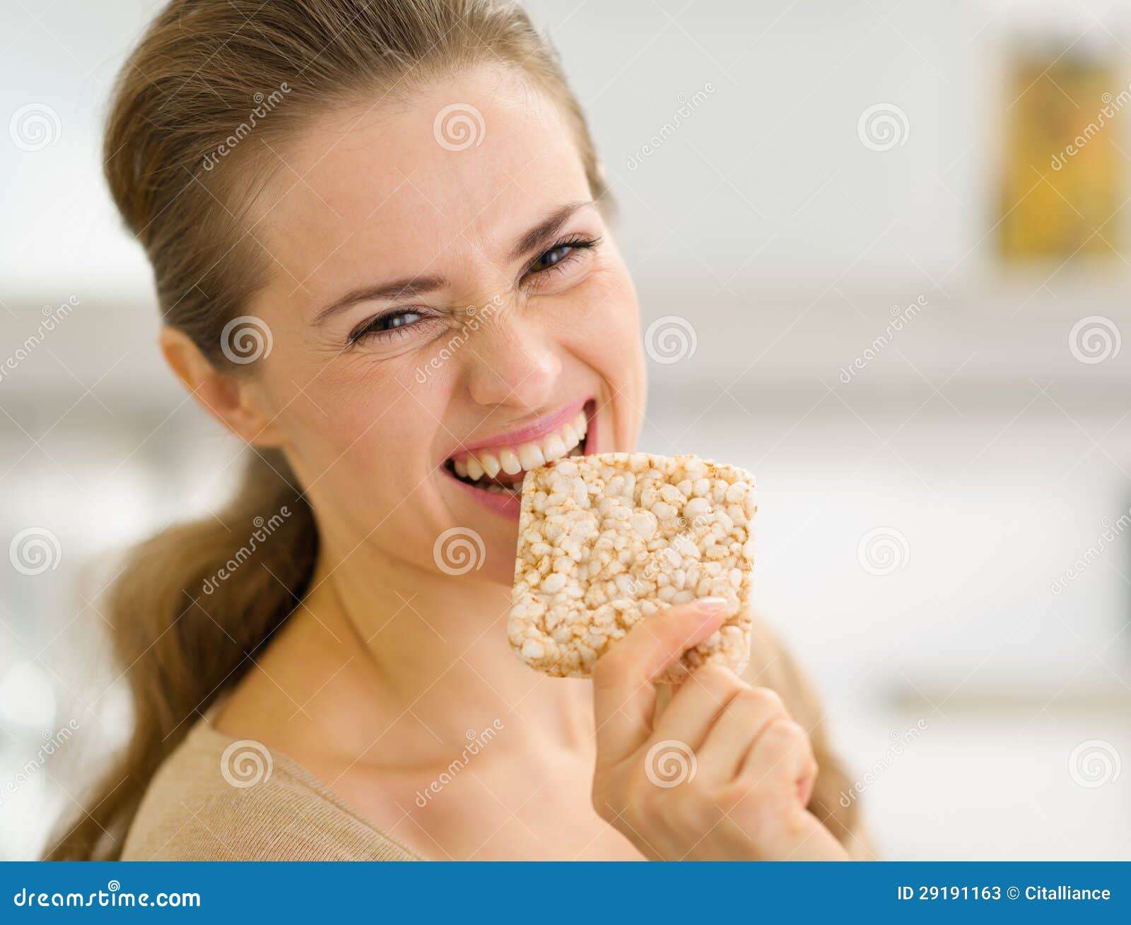 Happy Young Woman Eating Crisp Bread Stock Image - Image of grains ...
