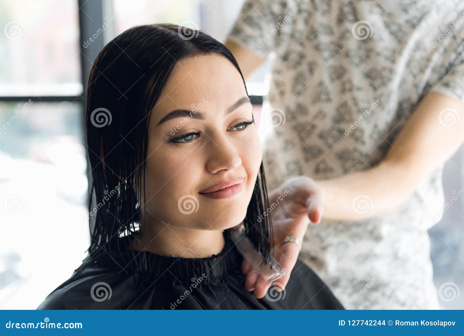 Happy Young Woman Getting a New Haircut by Hairdresser at Parlor Stock ... Happy Young Woman Getting a New Haircut by Hairdresser at Parlor Stock ...
