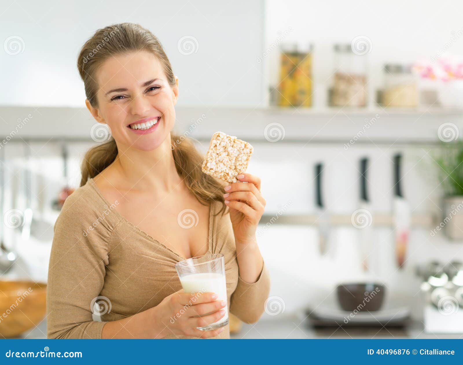 Happy Young Woman Having Snacks In Kitchen Stock Photo - Image of happy ...