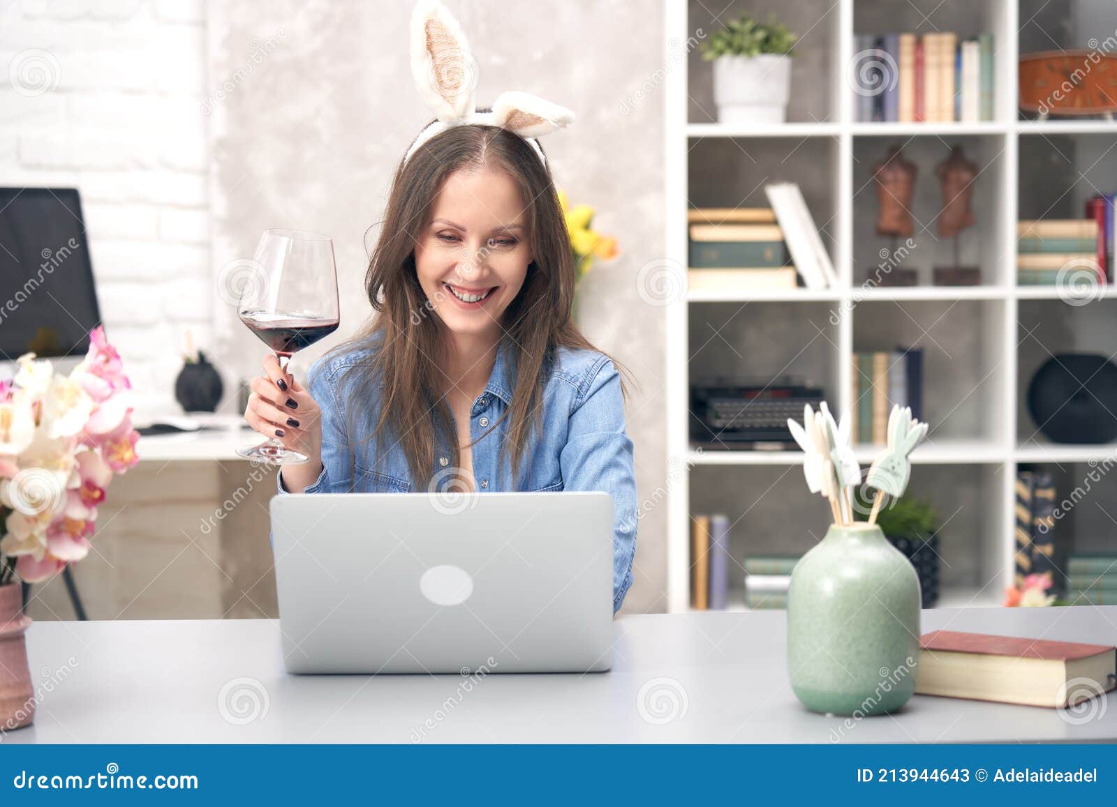 Happy Young Woman Having Video Chat, Wearing Easter Bunny Ears at Home ...