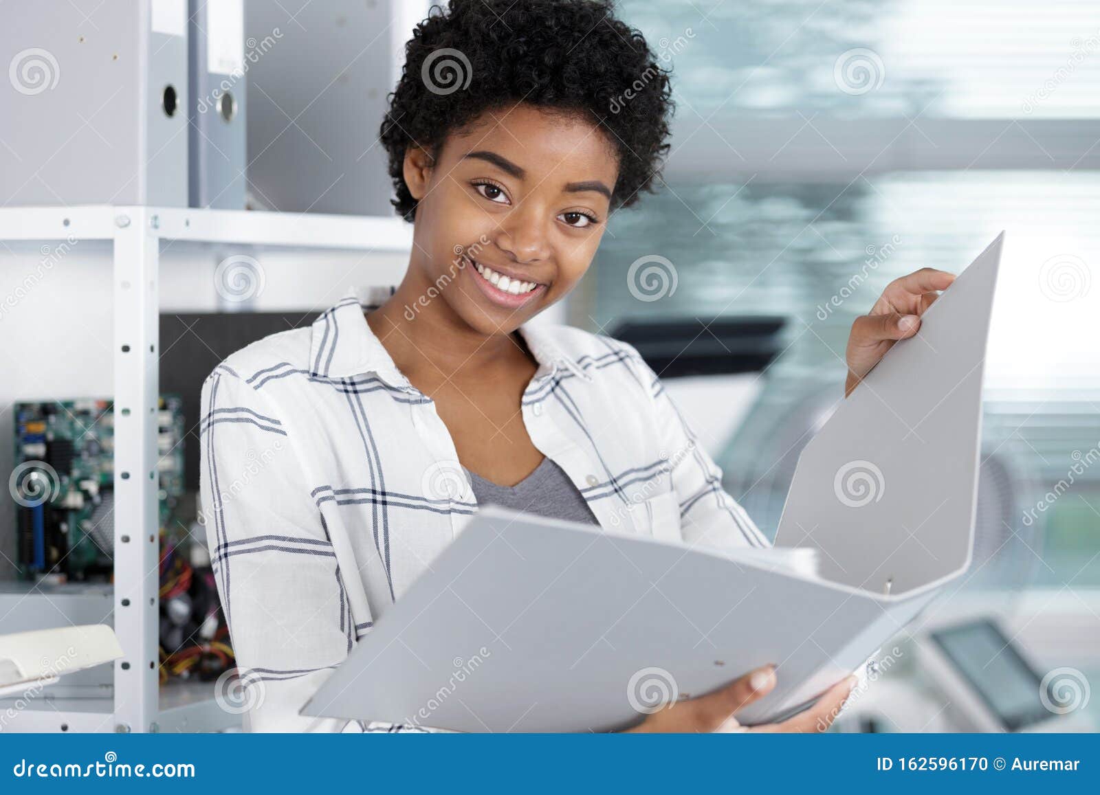 Happy Young Woman Holding Documents Stock Photo - Image of ...
