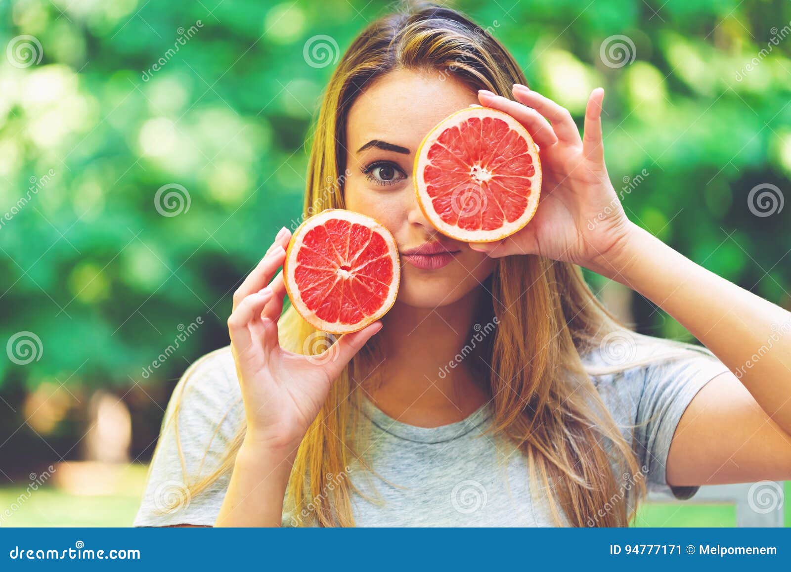 Happy Young Woman Holding Grapefruit Stock Image - Image of face ...