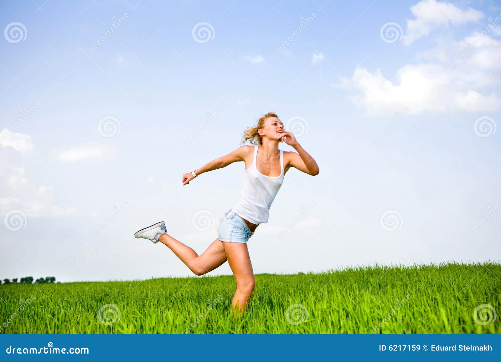 Happy Young Woman is Running in a Field Stock Image - Image of outdoor ...