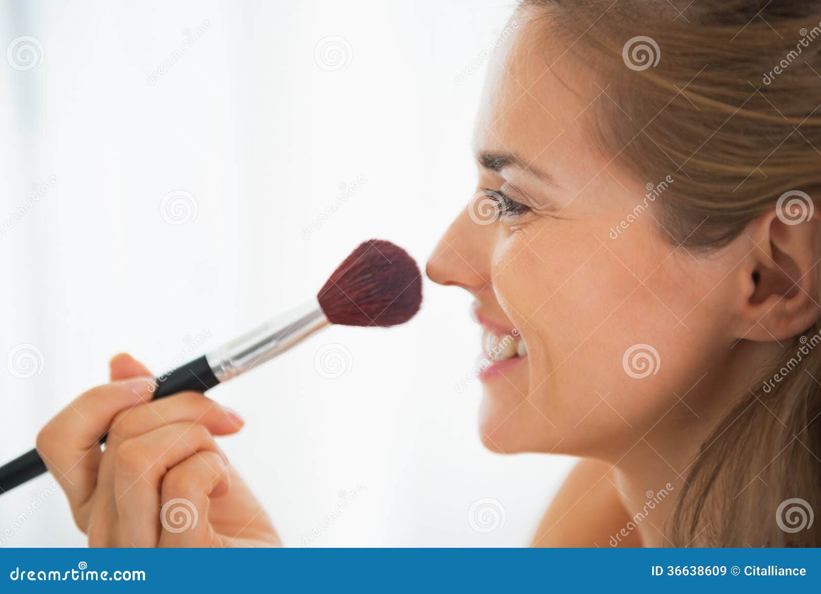 Happy Young Woman Using Makeup Brush Stock Image - Image of relax ...