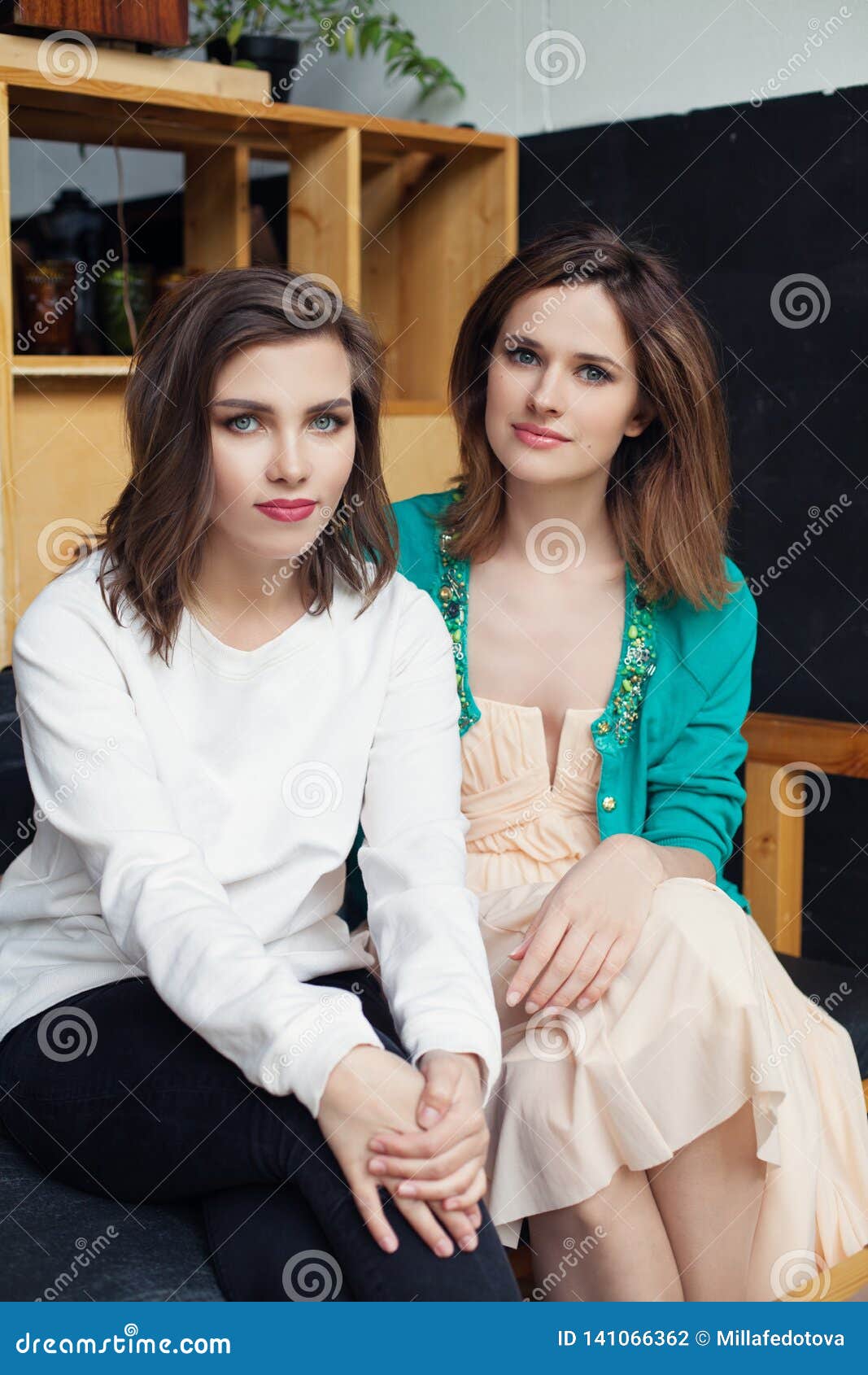 Happy Young Women Sitting Indoor, Lifestyle Portrait Stock Photo ... Happy Young Women Sitting Indoor, Lifestyle Portrait Stock Photo ...
