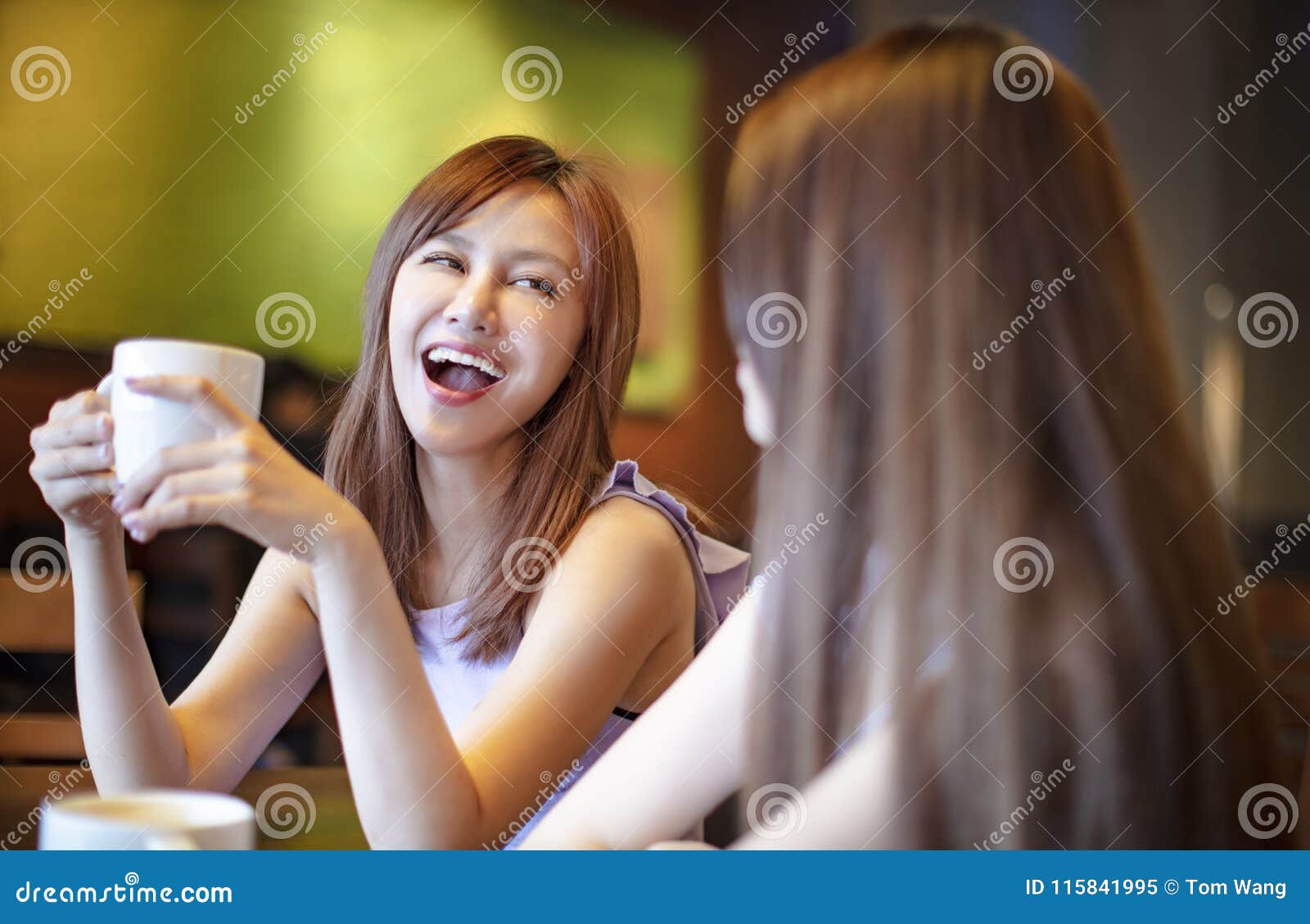 Young Women Talking In Coffee Shop Stock Image Image Of Chinese