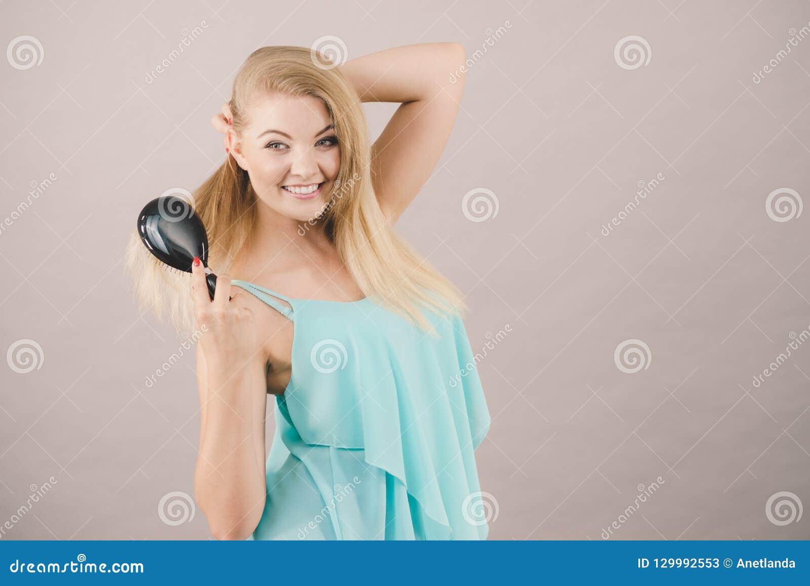 Blonde Woman Brushing Her Long Hair Stock Image Image Of Female