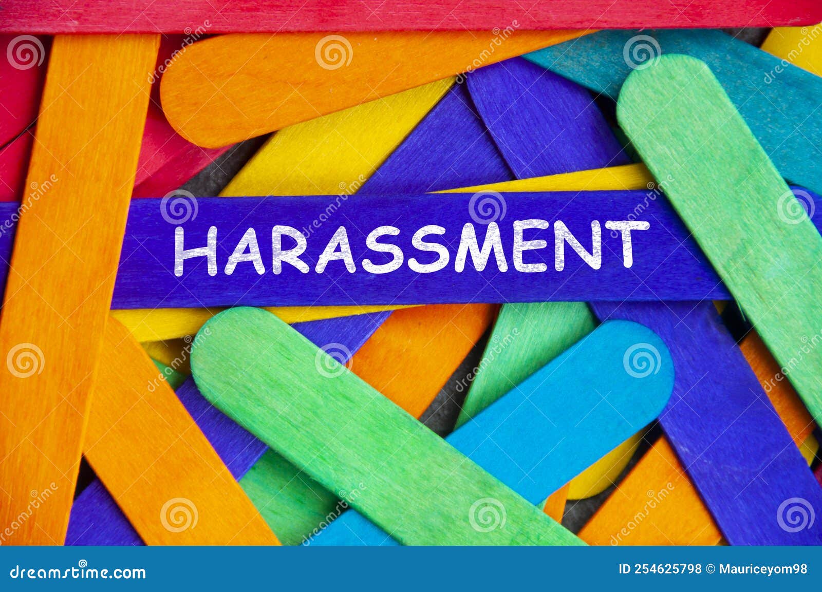 Harassment Text on Blue Wooden Stick Surrounded by Other Sticks ...