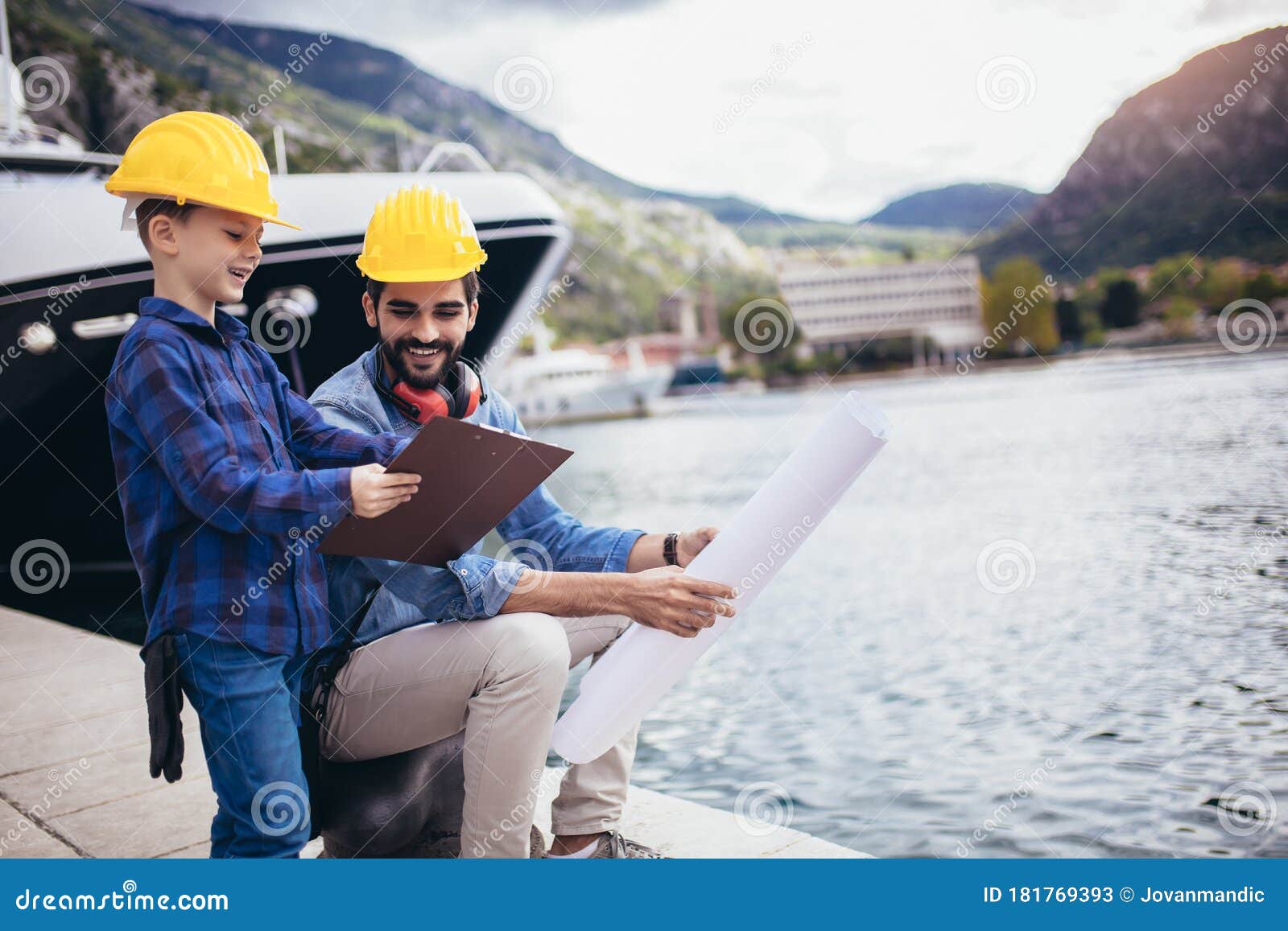 Harbor Engineer with His Son Holding the Paper, Construction Work Stock ...