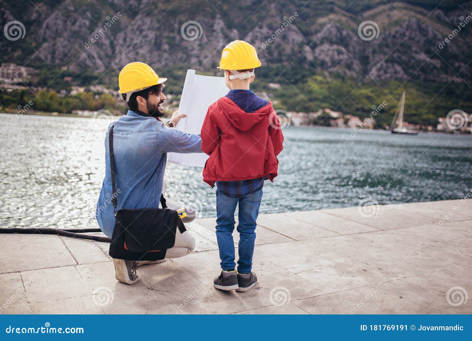 Harbor Engineer with His Son Holding the Paper, Construction Work Stock ...