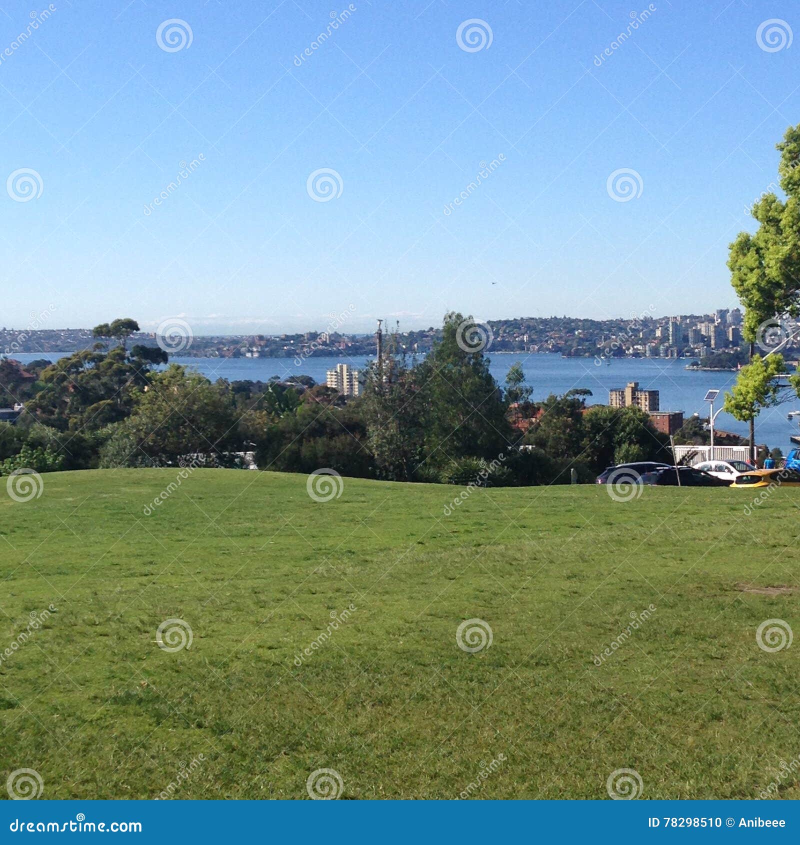 Harbour View from Across a Park Stock Photo - Image of clouds, view ...