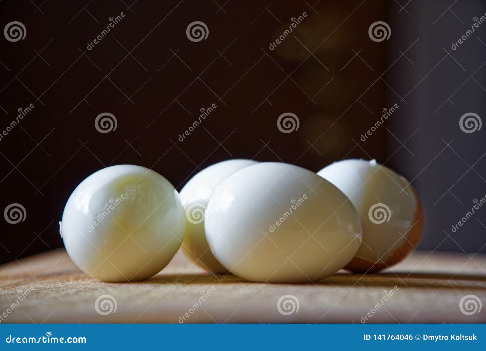 Hard Boiled Eggs with Shell beside on Wooden Board Stock Photo - Image ...