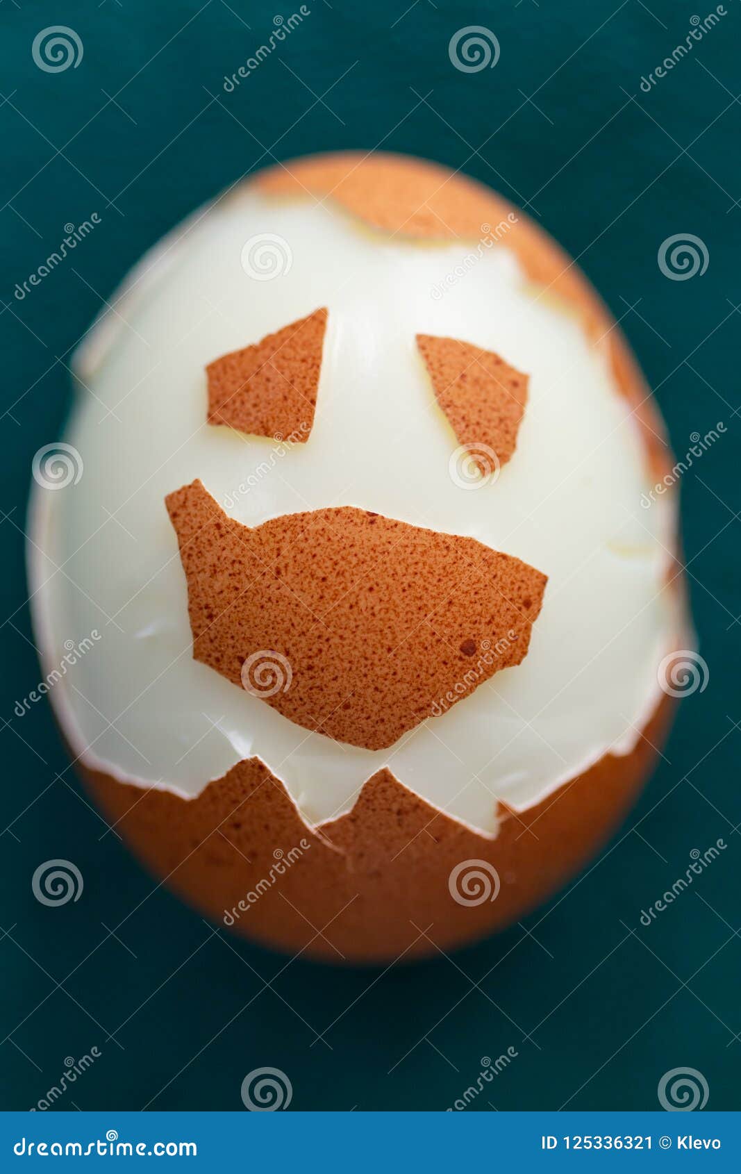 A Boiled Egg Cut In Half On A Plate. The Hand Reaches For Food. Healthy ...