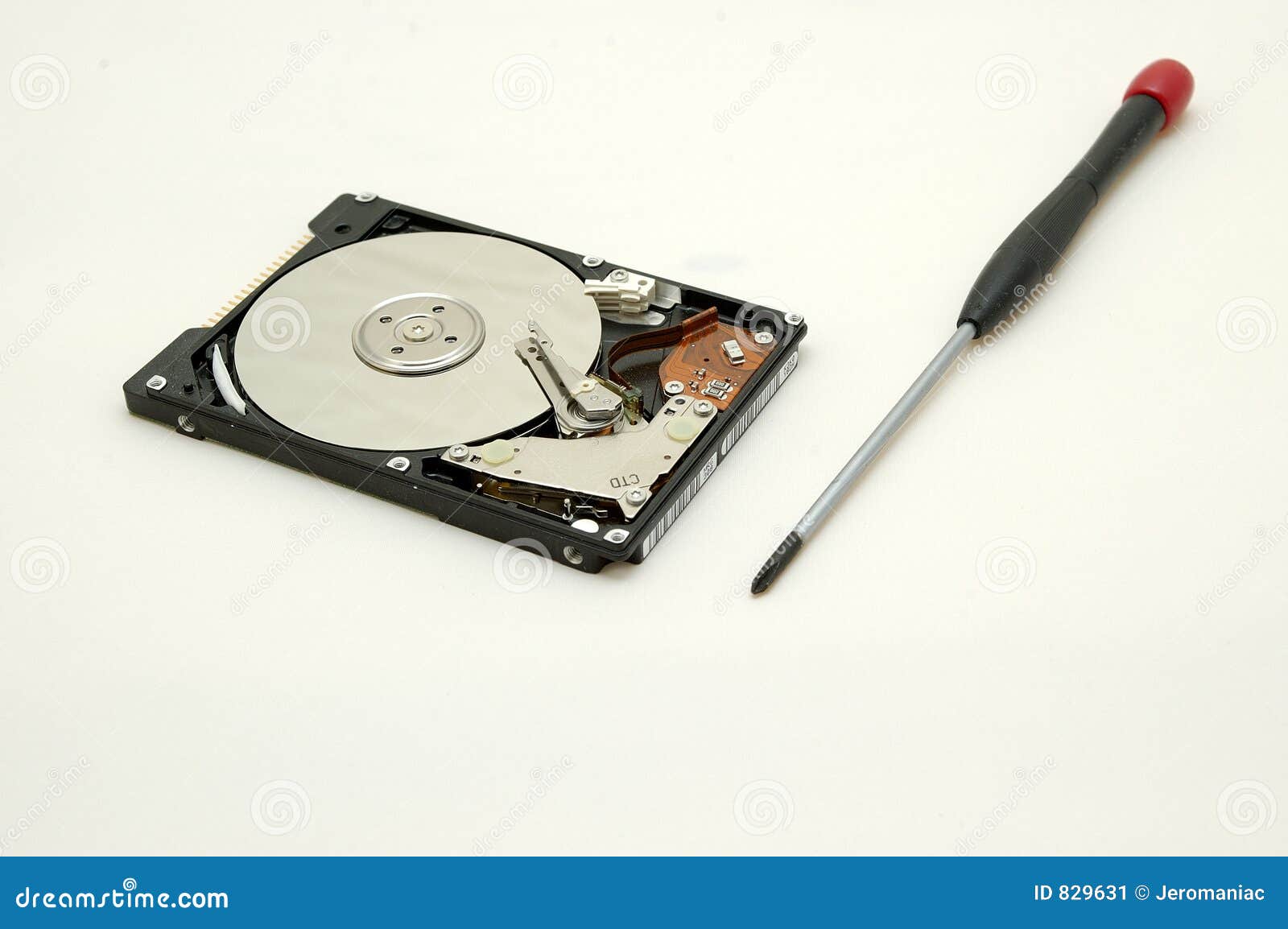 Hard disc and screwdriver stock image. Image of electronics - 829631
