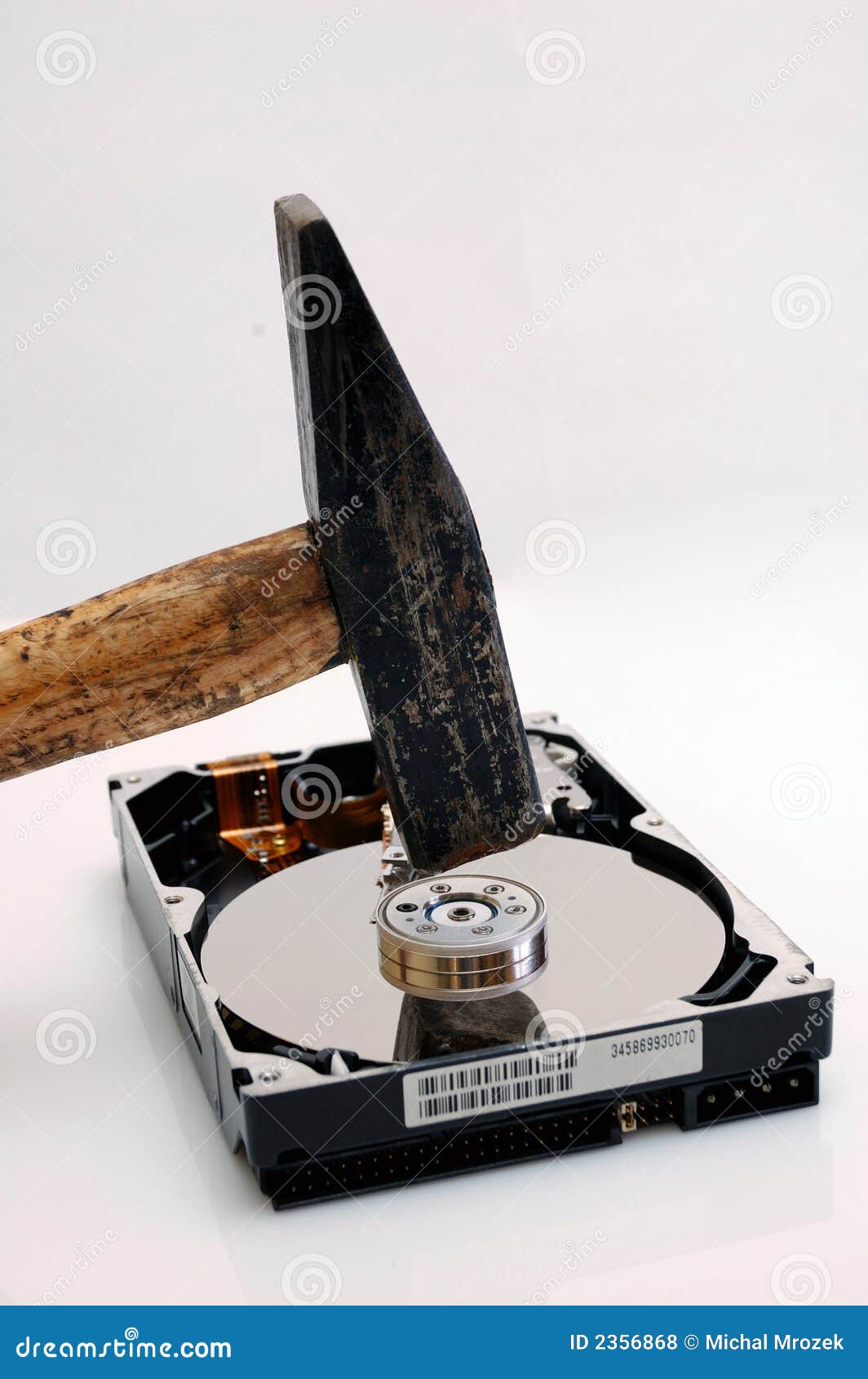 Hard disk and a hammer stock photo. Image of information - 2356868