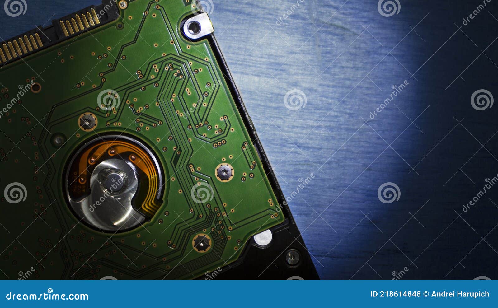 Hard drive on a blue table stock photo. Image of disk - 218614848