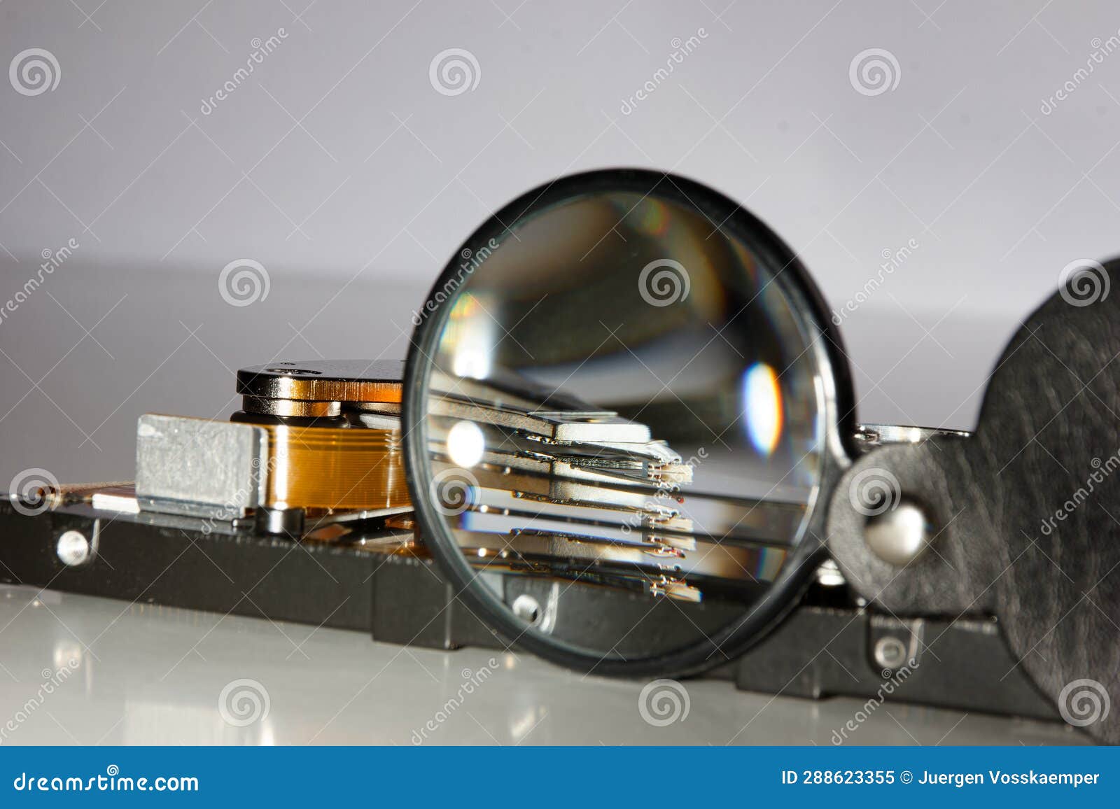 Hard Drive and Magnifying Glass, Representing the Process of Searching ...