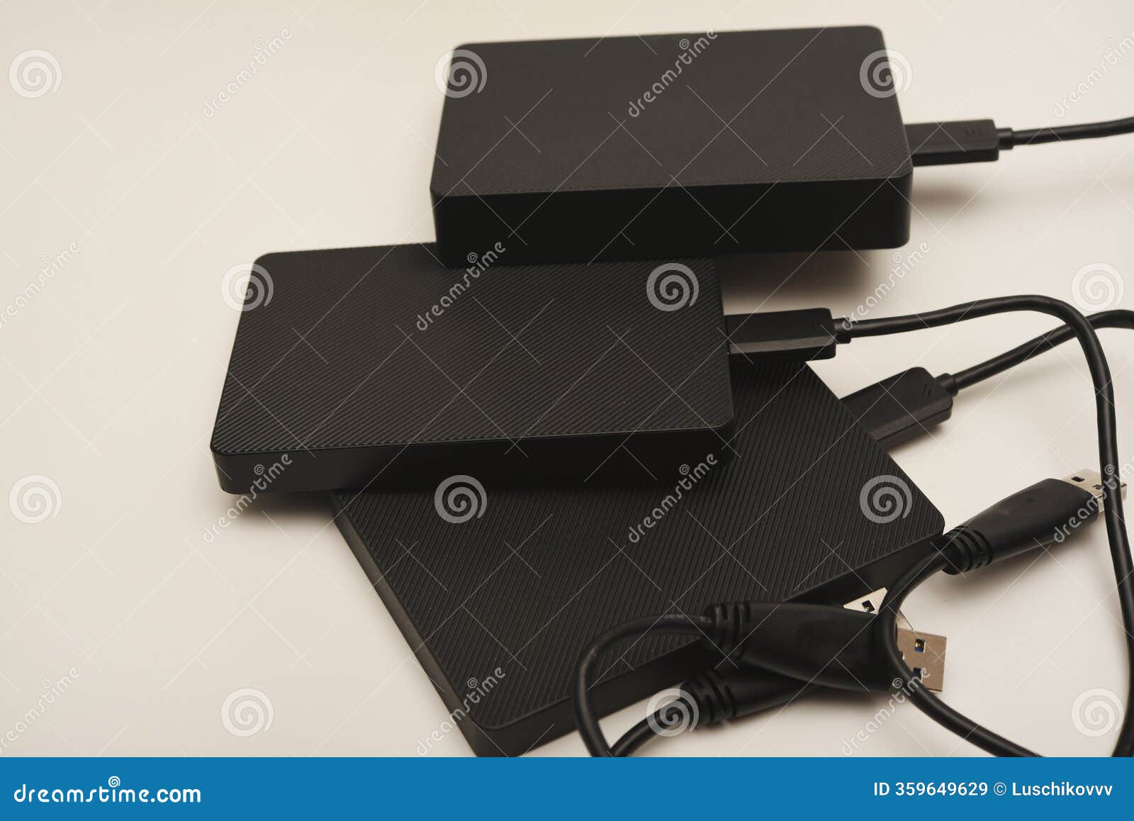 Hard Drives on a White Background. Modern Data Storage Devices with USB ...