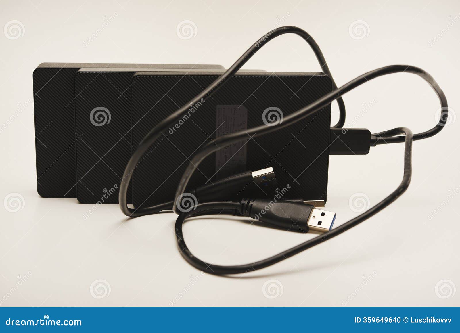 Hard Drives on a White Background. Modern Data Storage Devices with USB ...