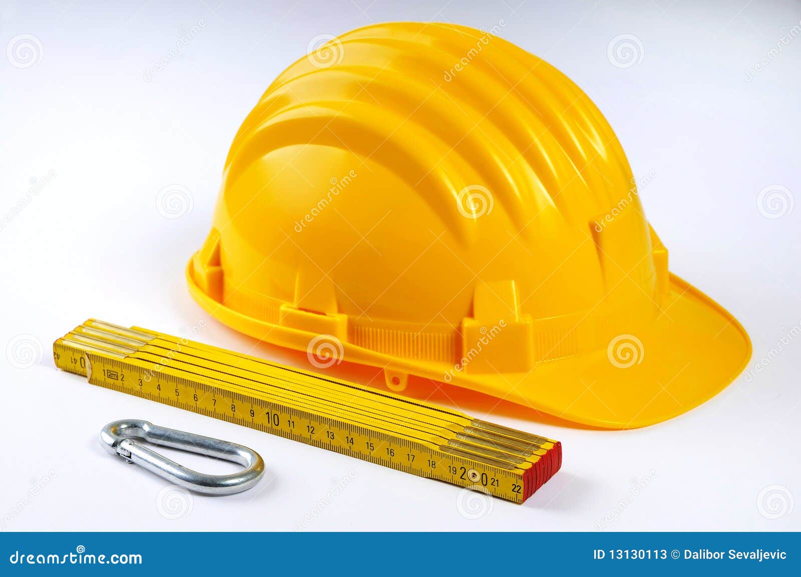 Hard hat with folded ruler stock image. Image of view - 13130113