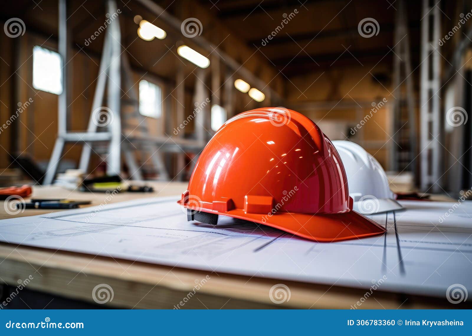 A Hard Hat Sits on Top of Red Blueprints on a Table Stock Photo - Image ...