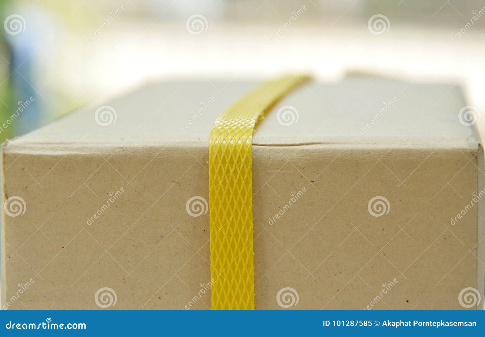 Hard Paper Parcel Wrapped by Yellow Plastic Band Stock Image - Image of ...