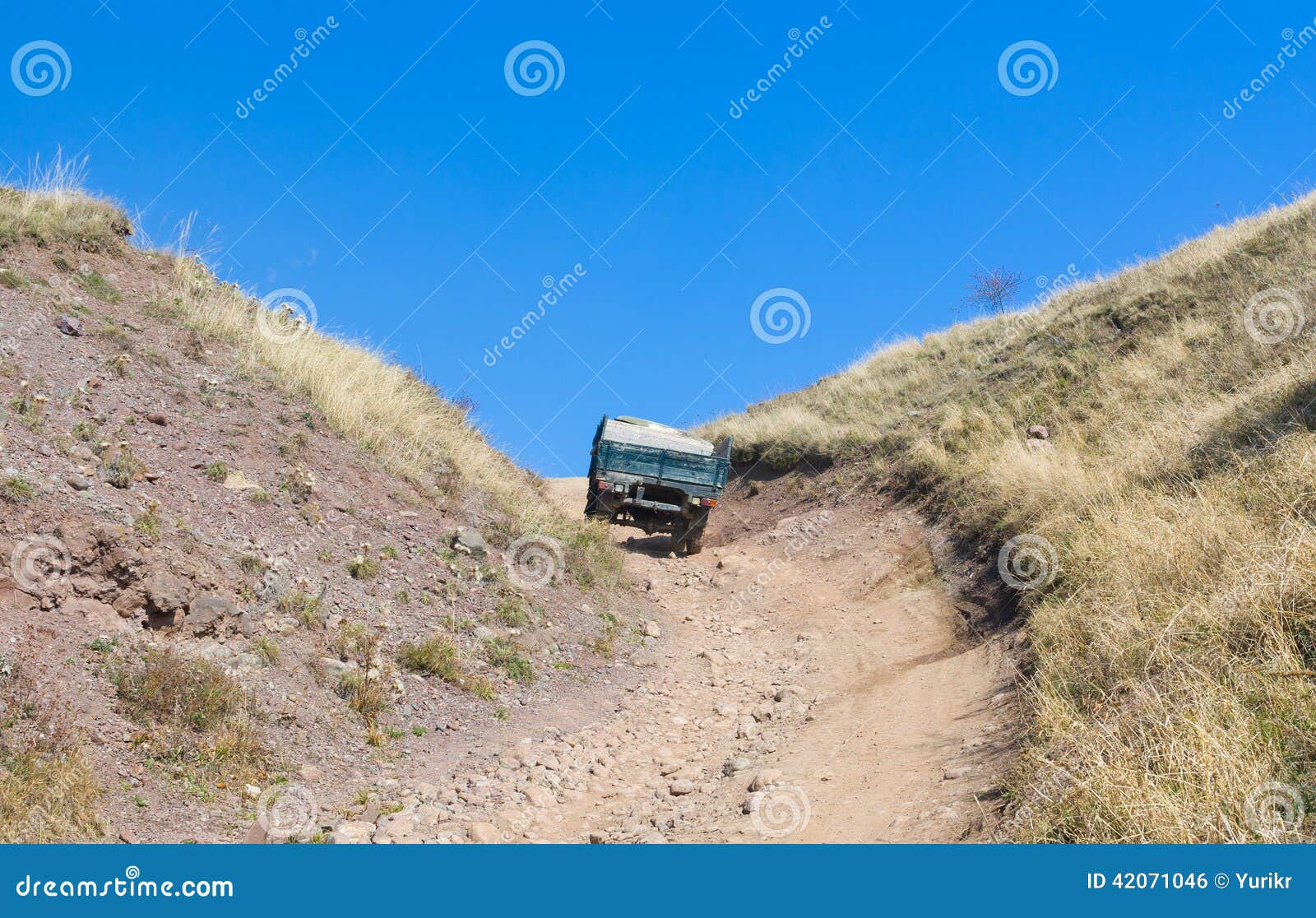 Hard road in mountains stock photo. Image of rocky, back - 42071046