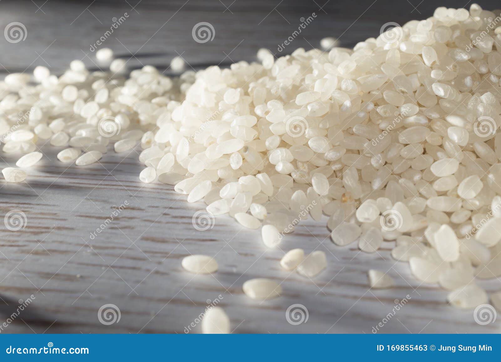 White Rice on Wood Background Stock Image - Image of grain ...