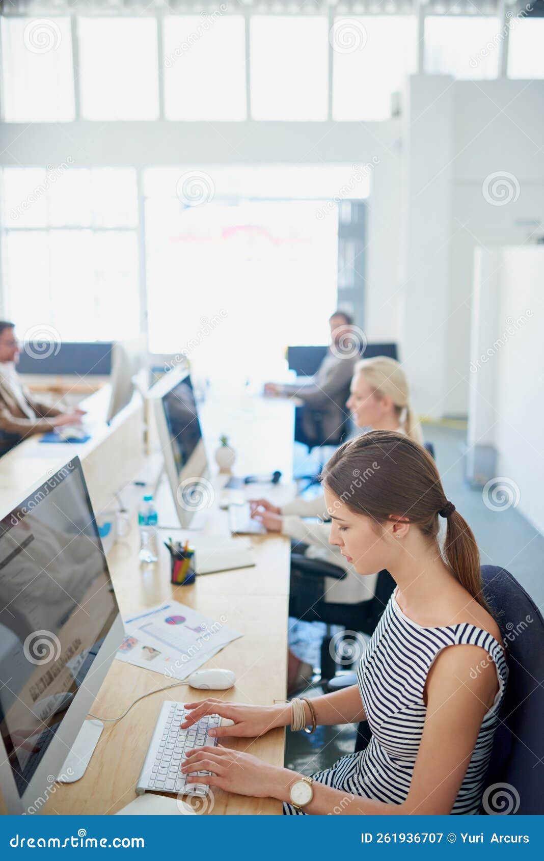 Hard at Work on Design. a Group of Young Designers Working at Their ...