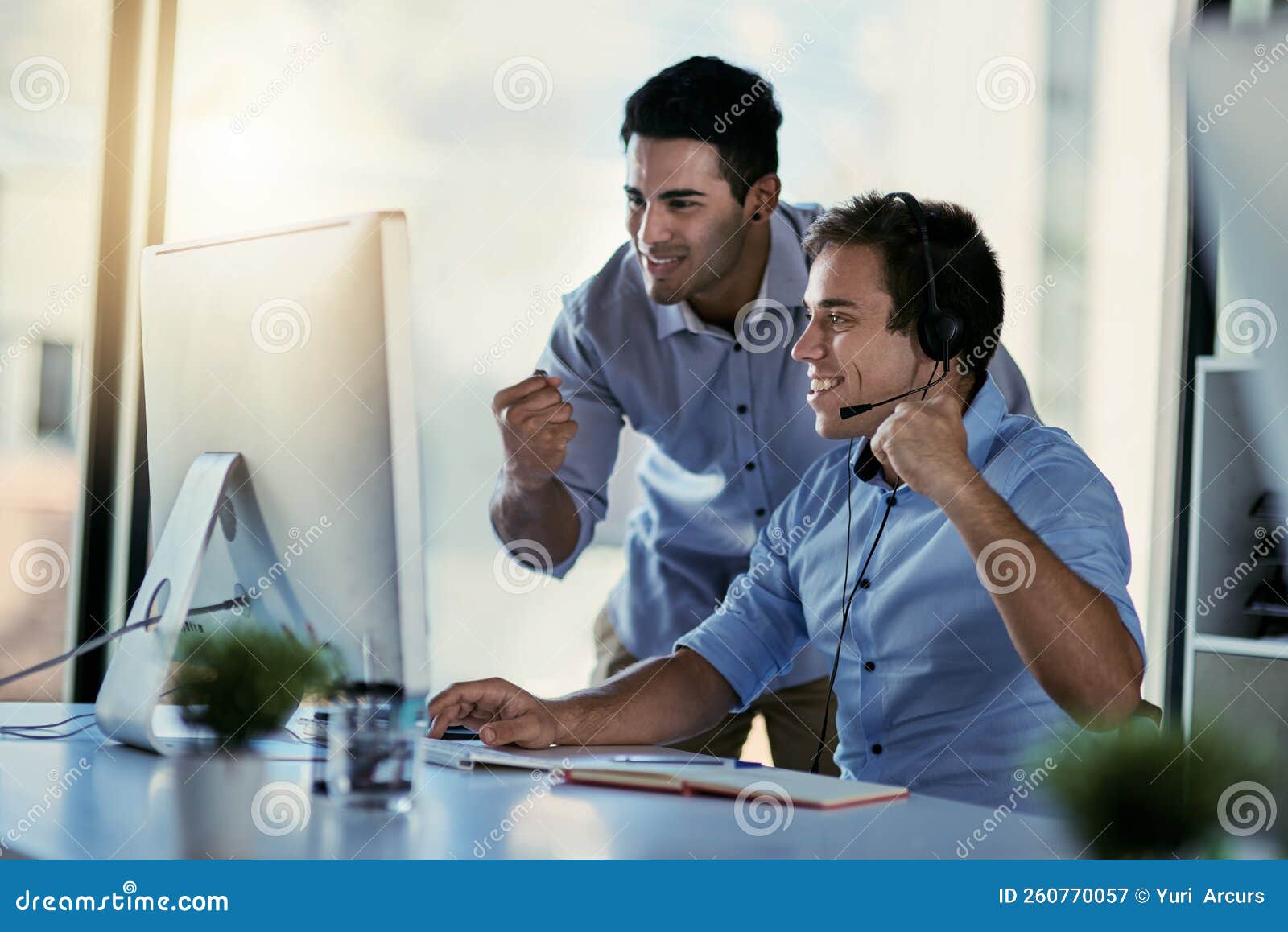 Hard Work Does Indeed Pay Off. Two Call Centre Agents Doing a Fist Pump ...