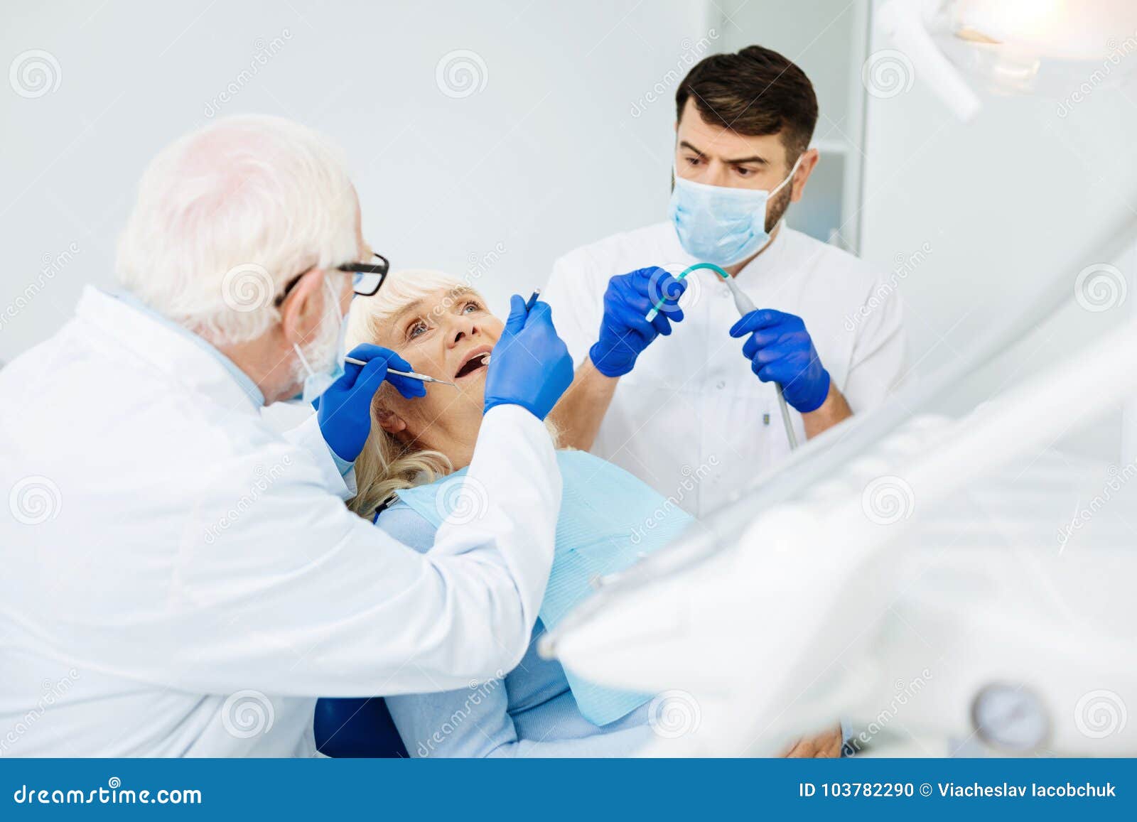 Skilled Dentists Curing the Patient Stock Photo - Image of dent ...