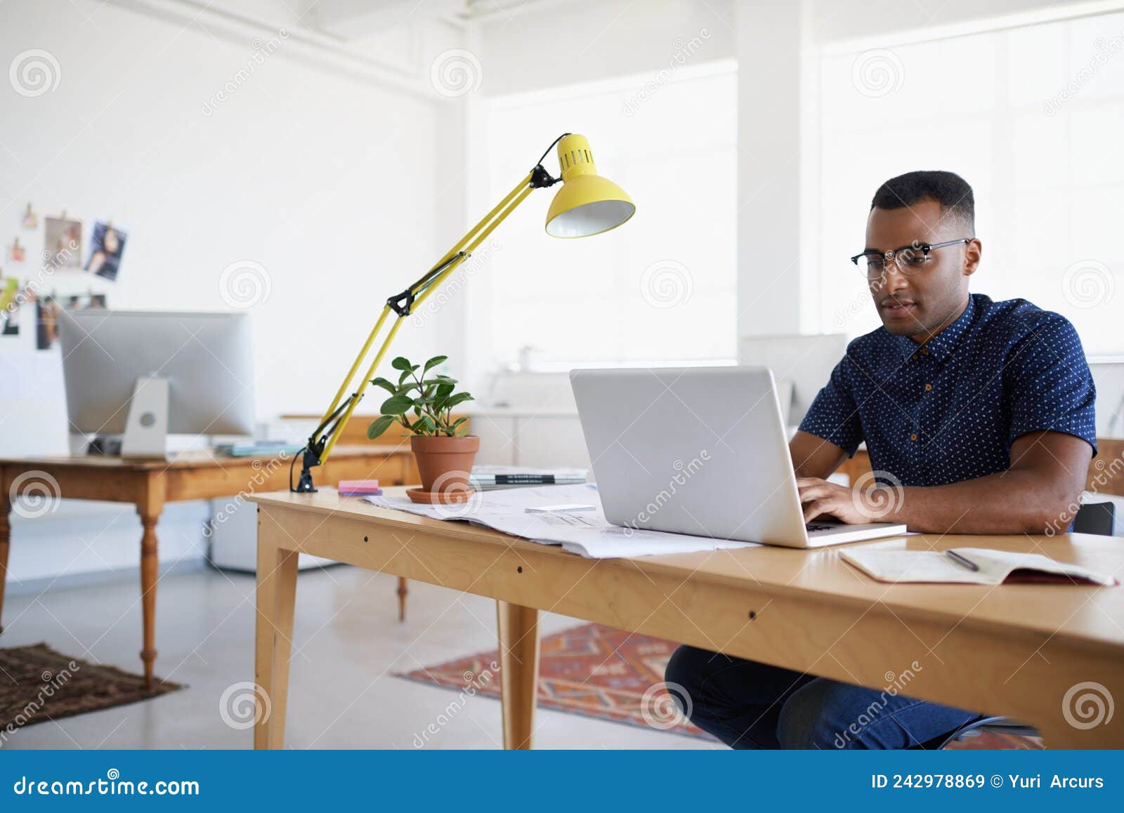 Hard at Work. a Handsome Young Man Working at His Desk. Stock Image ...