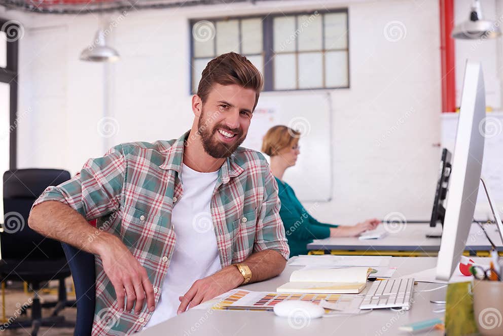 Hard at Work. a Handsome Young Man Working in His Office. Stock Photo ...