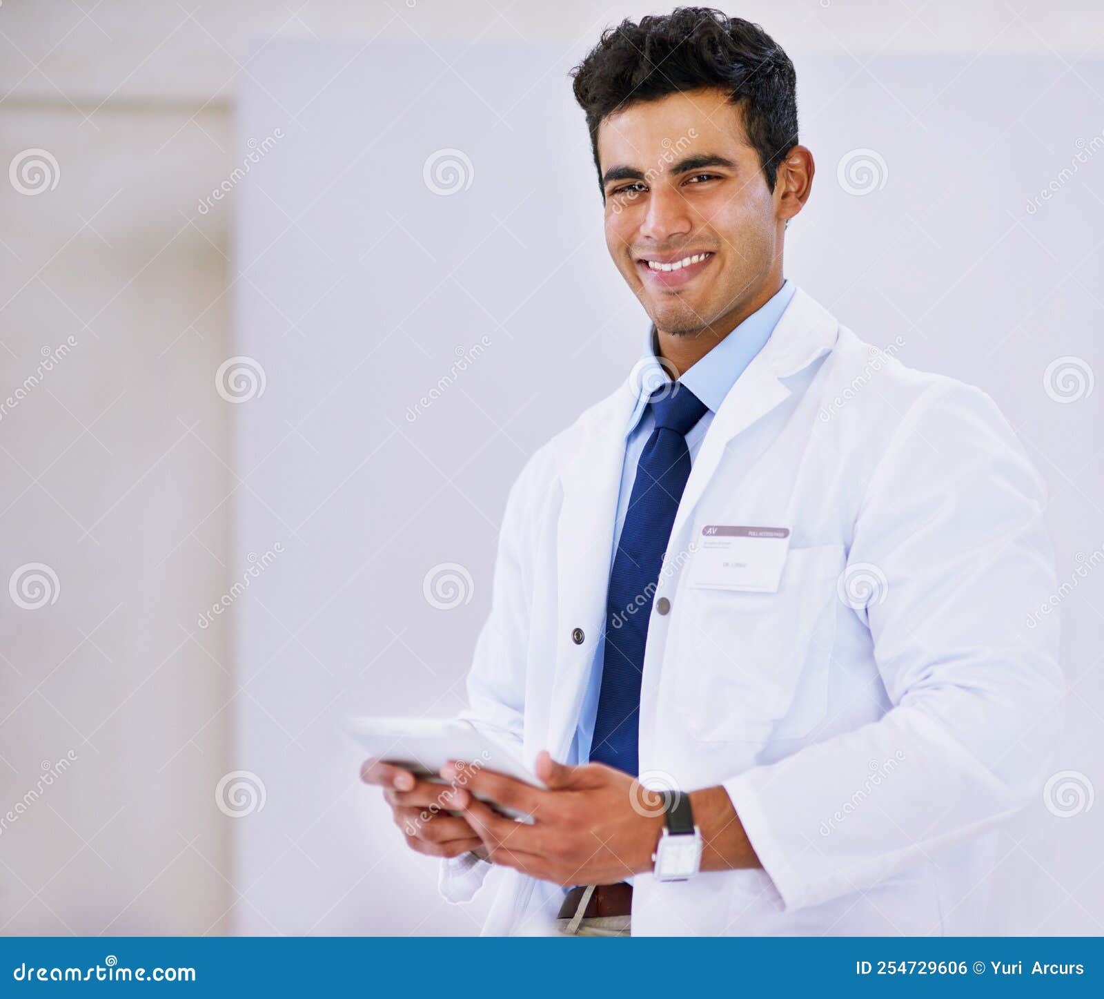 Hard at Work in the Lab. Portrait of a Smiling Lab Technician Using a ...