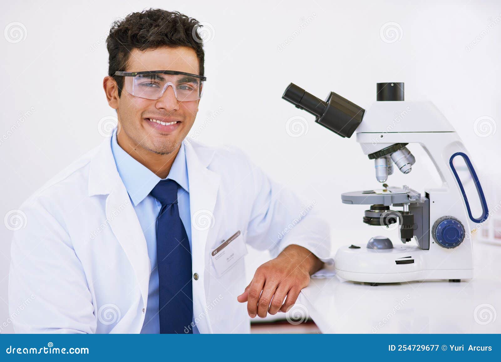 Hard at Work in the Lab. Portrait of a Smiling Lab Technician Using a ...