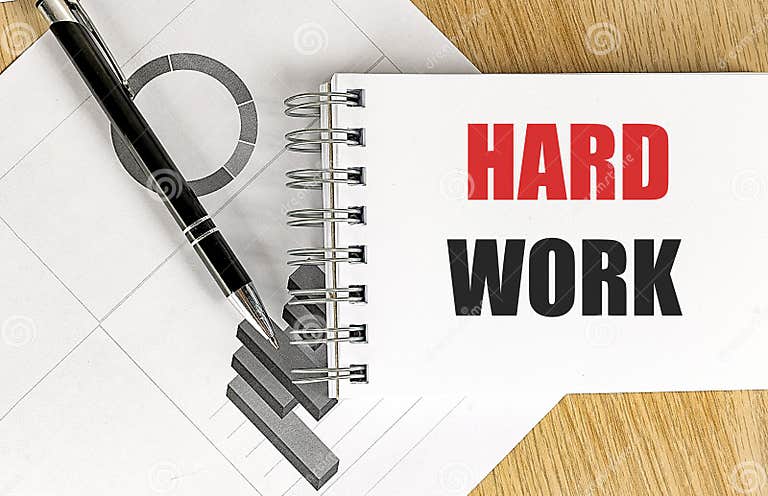 HARD WORK Text on Notebook with Chart on Wooden Background Stock Image ...
