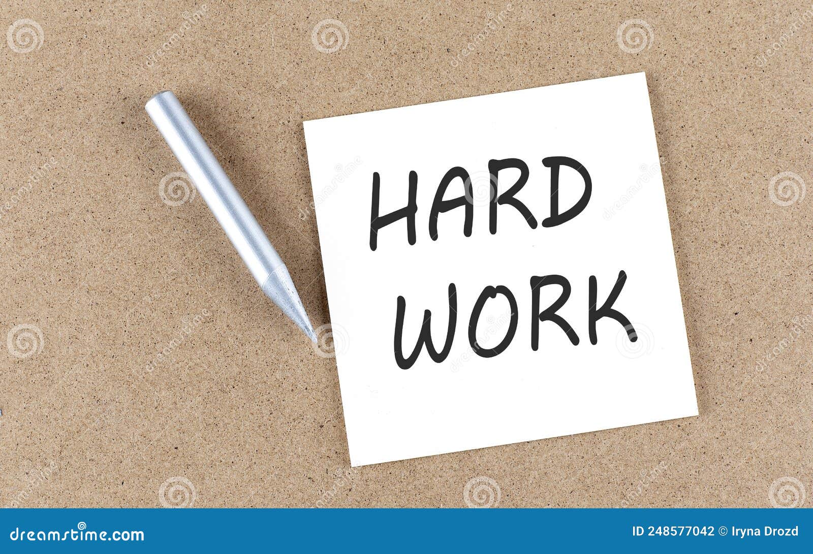 HARD WORK Text on Sticky Note on a Cork Board with Pencil Stock Photo ...