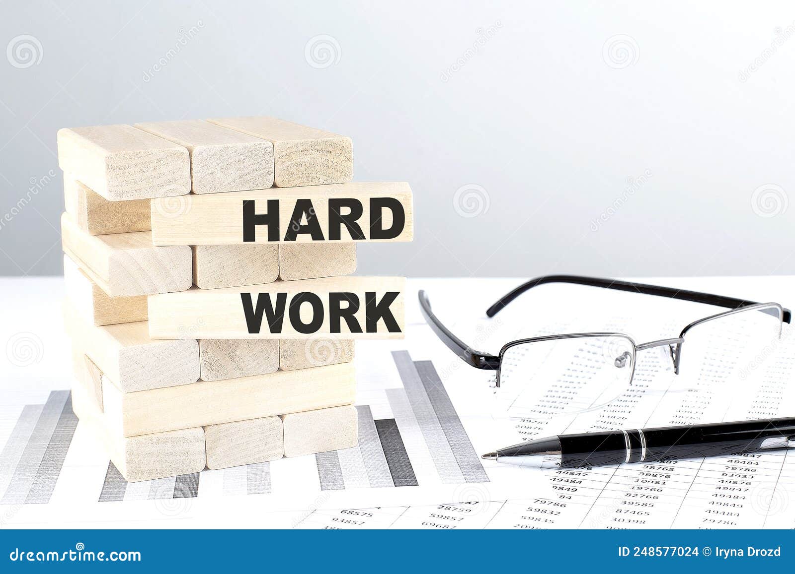HARD WORK is Written on Wooden Blocks on a Chart Background Stock Photo ...