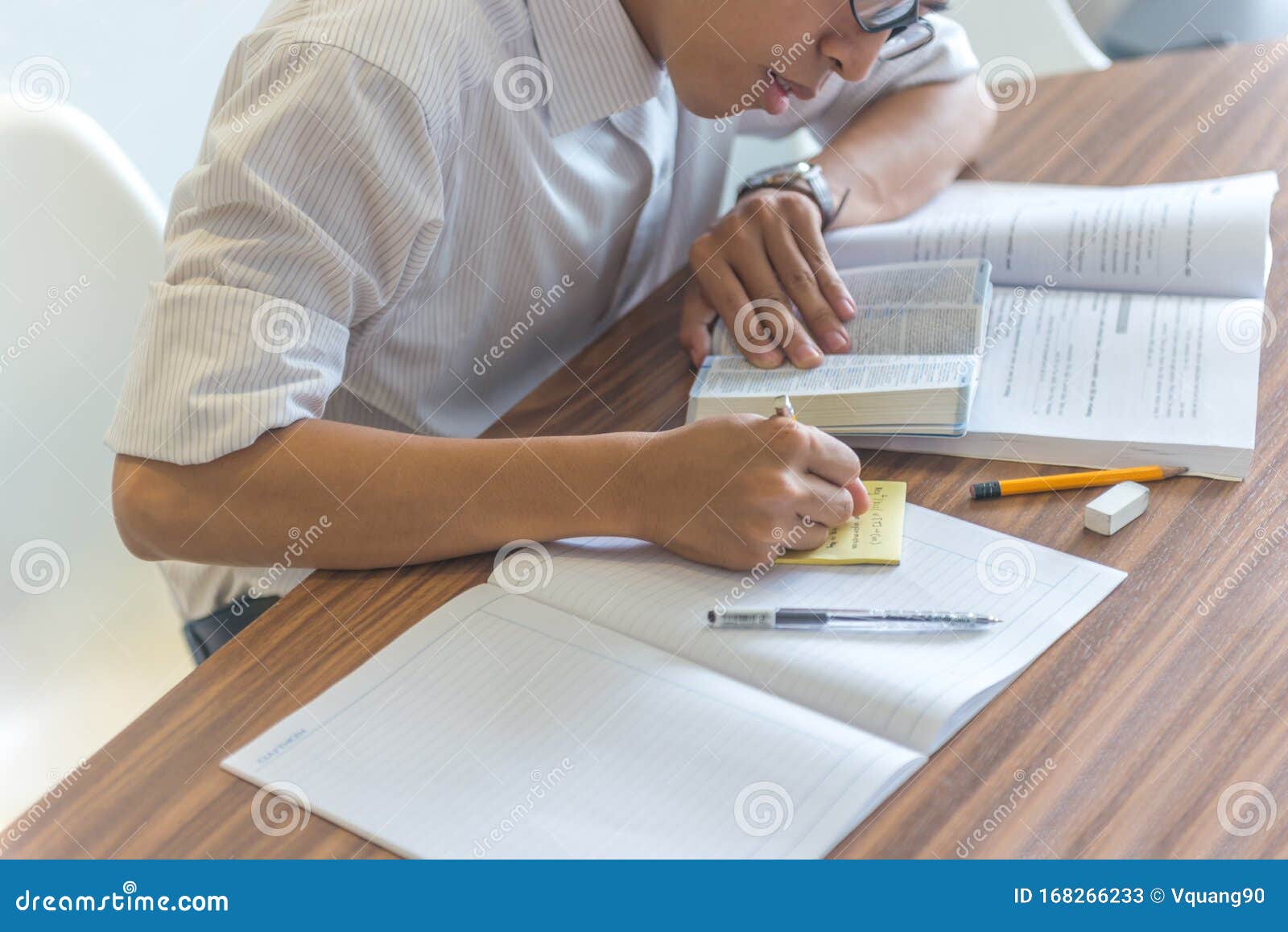 Hard Working Student Doing Homework in the Class Stock Image - Image of ...