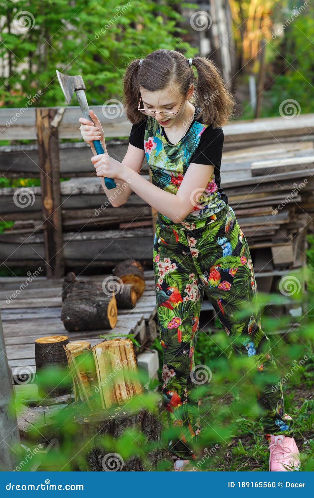 Hard-working Girl Chopping Wood Stock Photo - Image of girl, spectacles ...