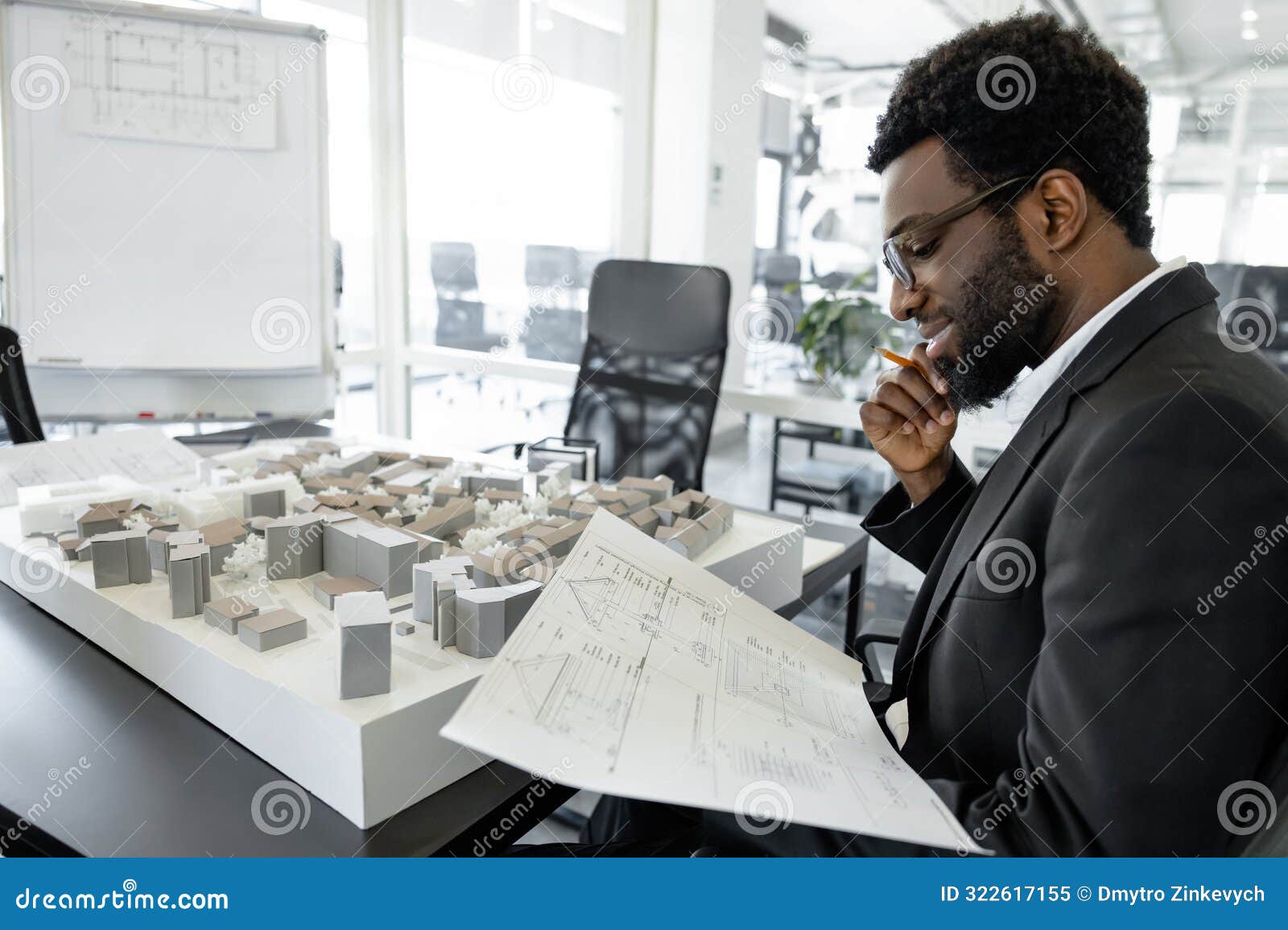 Hard Working Man Architect Conceptualizing New Exterior Designs in the ...