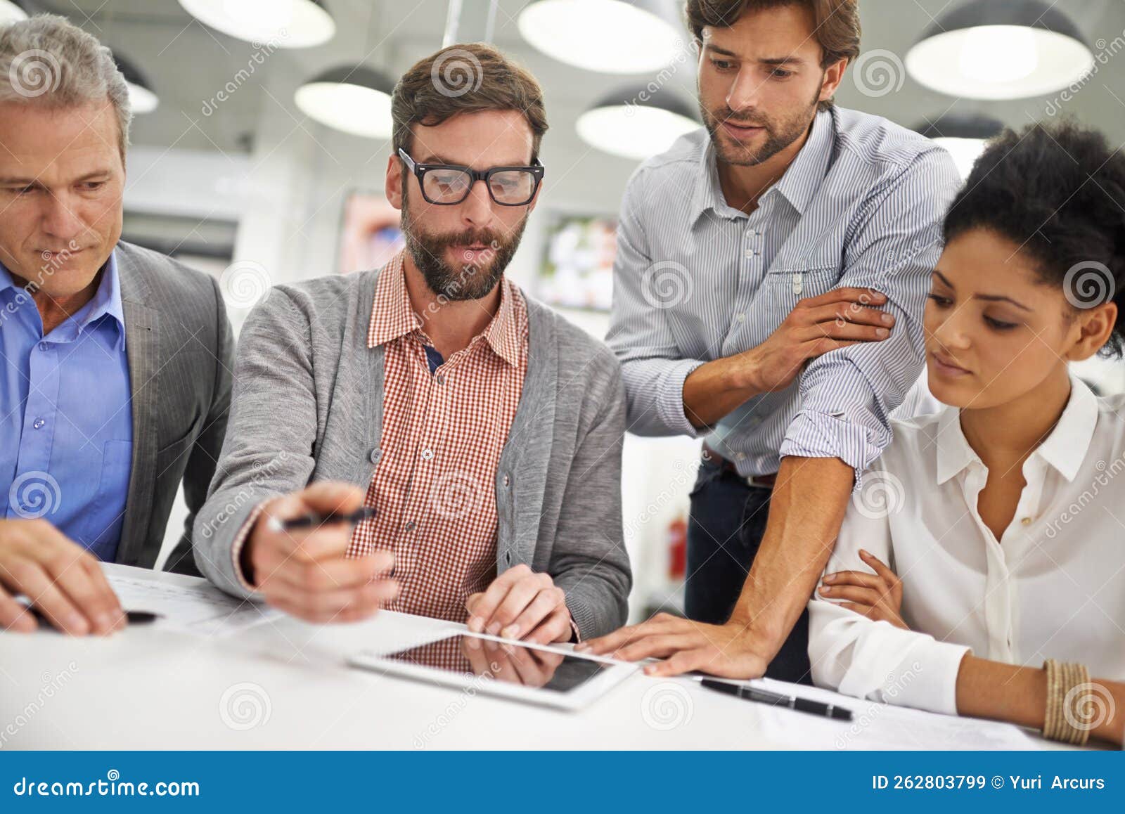 Hard Working Office Pros. a Group of Young Professionals Working at a ...